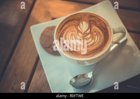 Top view of hot cappuccino coffee cup on wood table at cafe,food and ...