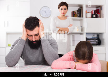 Young father and mother correcting their child for disobedience Stock ...