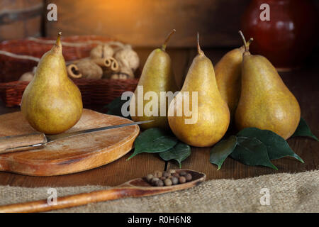 group of ripe pears lie on old wooden boards Stock Photo - Alamy