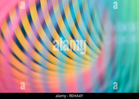 Swirls of blurred colors form abstract pattern from a plastic toy ...
