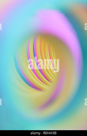 Swirls of blurred colors form abstract pattern from a plastic toy ...