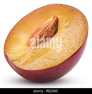 Fresh ripe plum cut in half in a plate with pits. copy space Stock ...