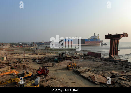 Bangladesh ship breaking yard (Chittagong). Ship recycling yard with industrial workers, heavy ...