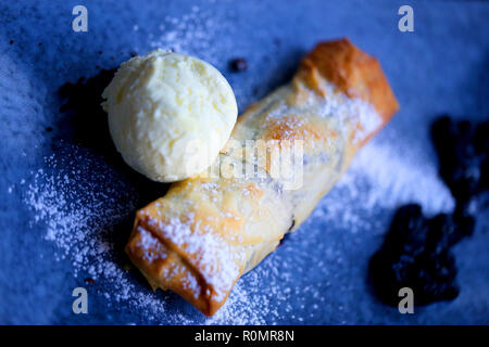 Macro photo of bright blueberry pie and ice cream on a dark plate Stock ...