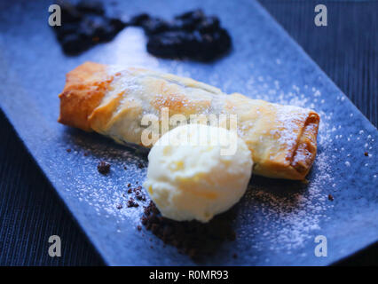 Macro photo of bright blueberry pie and ice cream on a dark plate Stock ...