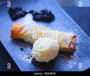 Macro photo of bright blueberry pie and ice cream on a dark plate Stock ...