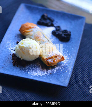 Macro photo of bright blueberry pie and ice cream on a dark plate Stock ...