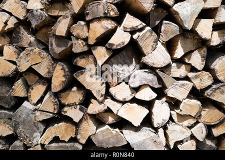 Pile of split logs Stock Photo - Alamy