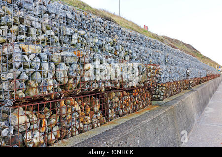 Gabions to protect the cliff base on the seawall in North Norfolk at ...