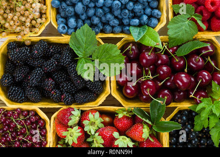 Baskets of berries in a market. mixed berries. bio colorful berries ...