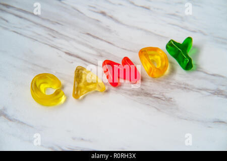 Assorted colorful gummy candy letters spell the word Halloween Stock ...