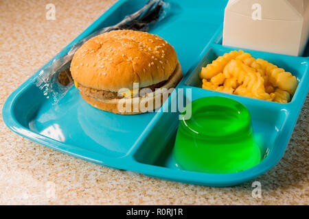 Elementary school lunch cheeseburger with ripple cut french fries ...