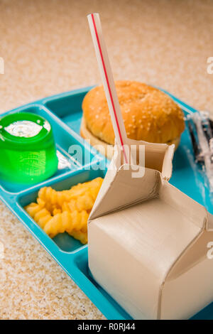 Elementary school lunch cheeseburger with ripple cut french fries ...