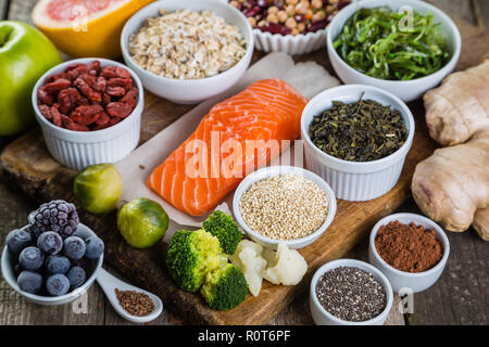 Selection of superfoods on rustic background Stock Photo - Alamy