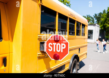 partial view of school bus with stop sign Stock Photo - Alamy