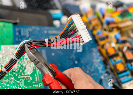 Disassembled computer hardware parts. E-waste pile detail. Colored ...