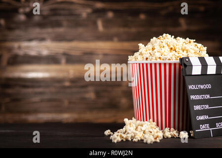 Full popcorn bucket on a dark background Stock Photo - Alamy