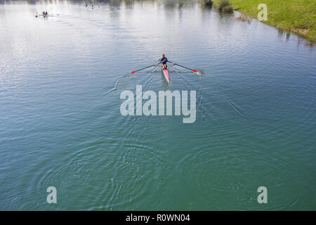Single scull rowing competitor Stock Photo - Alamy