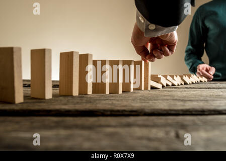 Man starting the domino effect from 2016 to 2017 knocking over the ...