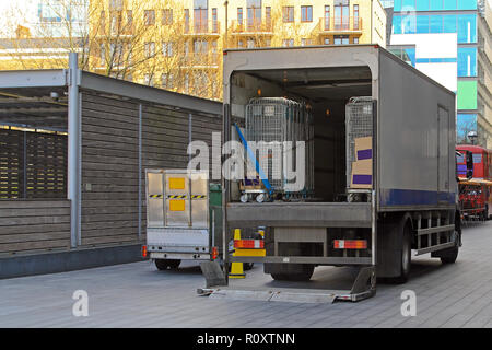 Open door at delivery truck with lift ramp Stock Photo - Alamy