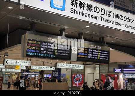 signs for the shinkansen train platforms at shinagwa railway station ...