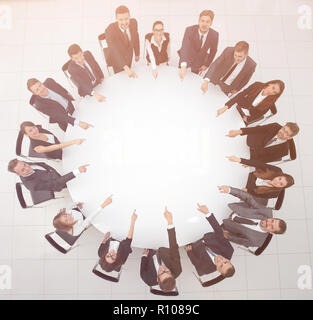 business team indicates the center of the round table Stock Photo - Alamy