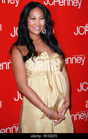 Kimora Lee Simmons models a red dress at the annual Heart Truth Fashion ...