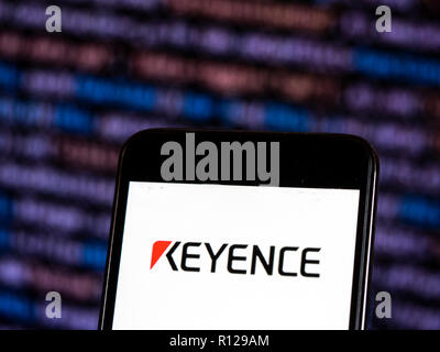 Keyence Company logo seen displayed on smart phone. Keyence Corporation ...