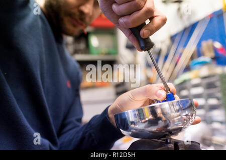 Fencing prop maker at work Stock Photo - Alamy