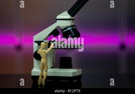 hinge drawing doll man and microscope Stock Photo - Alamy