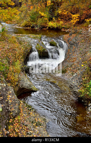 A vertical image of the waterfall in Waterford New Brunswick Canada ...