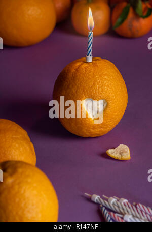 Tangerines on a light purple background. Minimal concept. Fruit flat ...