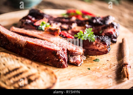 Grilled pork ribs with herbs Stock Photo - Alamy