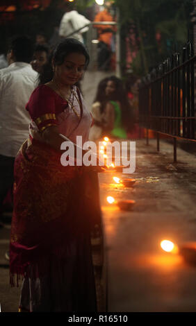 Indian people gathered in a temple and playing holi with colourful ...