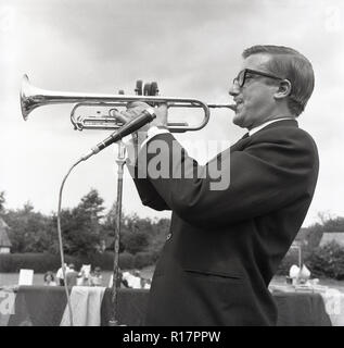 Roy Castle TV Presenter and Entertainer plays a trumpet to celebrate ...