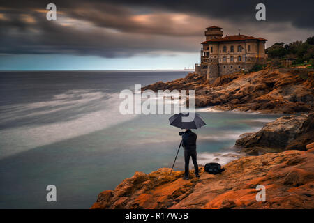 Boccale Castle on rocky coastline near Livorno at sunset, Italy Stock ...