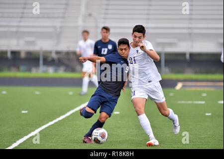 Opposing players in a physical battle for possession of the ball. USA ...