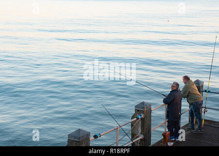 Man Fishing on Bournemouth Pier, Dorset, UK Stock Photo - Alamy