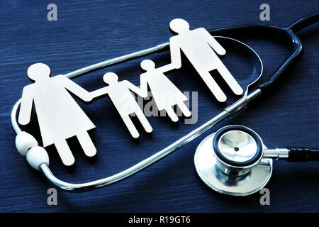 Family figures with stethoscope. Health insurance and medical care ...