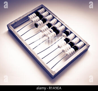 old abacus closeup on a grey background Stock Photo - Alamy
