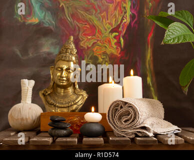 Beautiful composition with spa stones and candle on table on dark ...