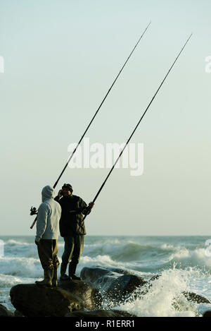 Surf fishing, two rods standing on the beach, Soustons Plage, evening ...