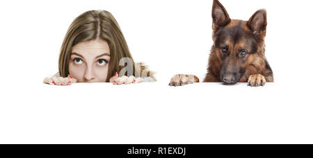 The sad serious woman and her dog over white background. Shetland ...