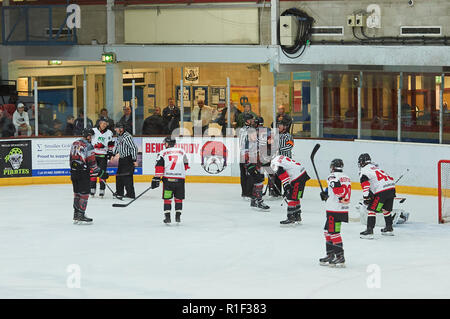 Referees breaking up a fight in an ice hockey match Stock Photo - Alamy