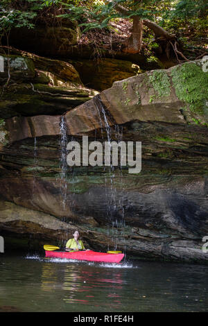 Kayaker behind a small waterfall on Grayson Lake in Kentucky Stock ...