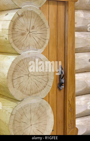 Wooden Swedish Cope profile log home wall with hinged wiring Stock ...
