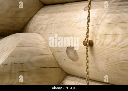 Wooden Swedish Cope profile log home wall with door on the backround ...