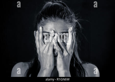 Close-up portrait of scared and alarmed young asian woman panicking ...