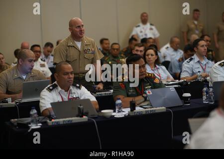 U.S. Marine Lt. Col. Arthur Bruggeman and his spouse set up a table ...