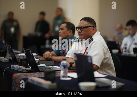 U.S. Air Force Col. Rudolph Cachuela, center left, Air Mobility Command ...